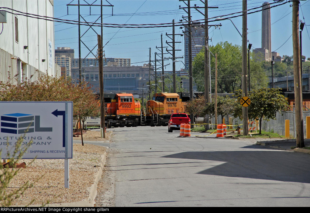 BNSF 9992 stare at each other on this coal load.